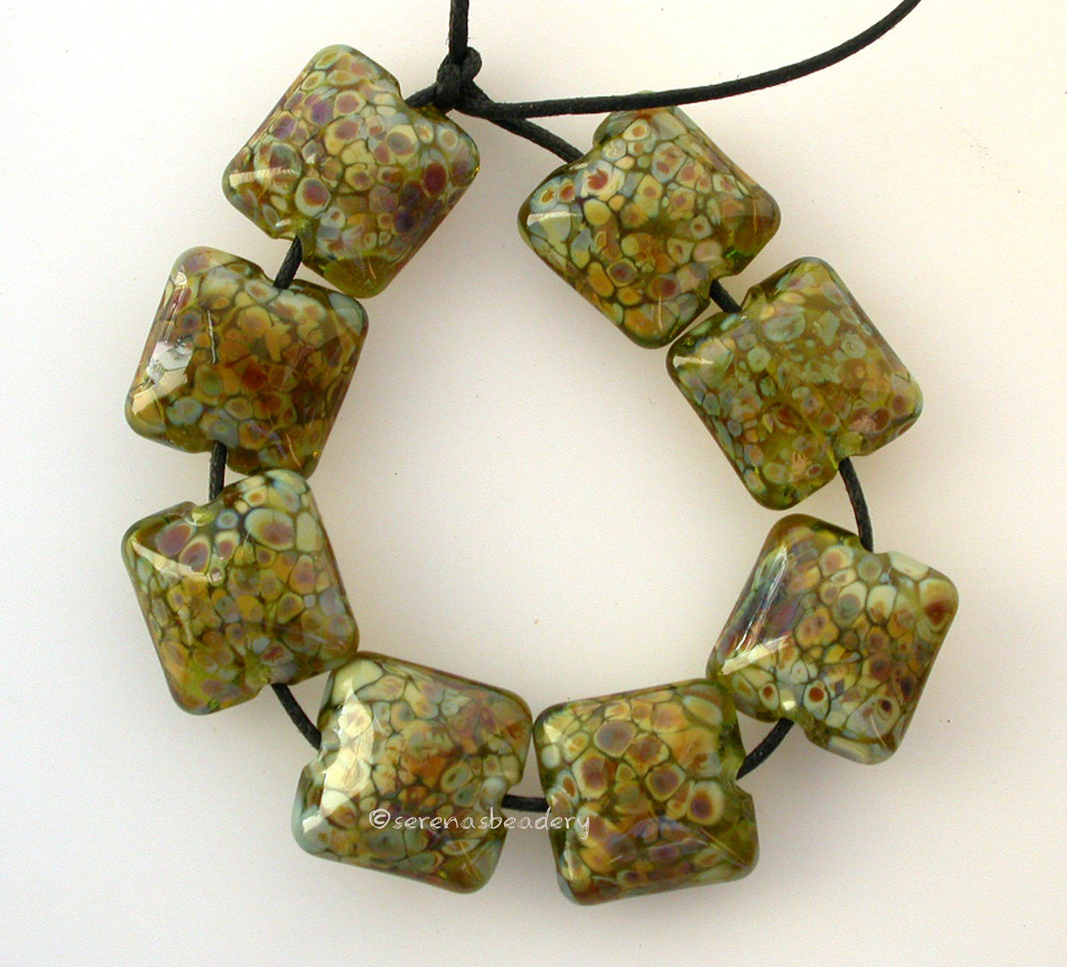 Transparent Olive Raku Pair a pair of transparent olive pillows covered ...